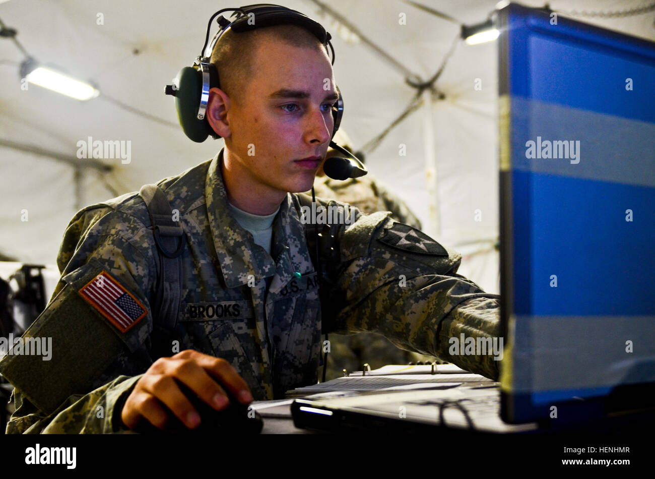 U.S. Army Pfc. John Brooks, a radio telephone operator with 3-2 Stryker ...