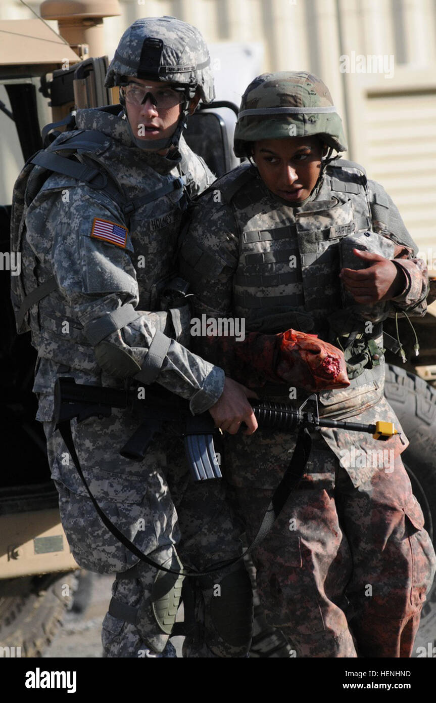 Spc. James Holmes, representing U.S. Army Forces Korea, helps a ...
