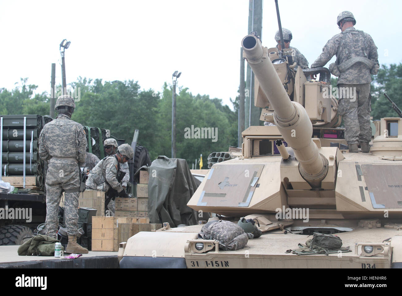 Soldiers preparee to pass out live ammunition to the tank crews from ...
