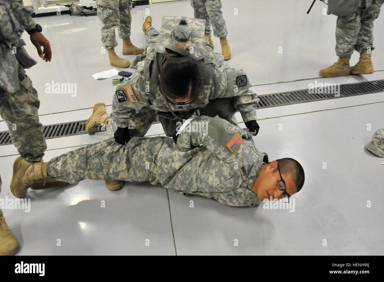 Sgt. Ayers searches Pfc. Benitez during prisoner detention training at ...