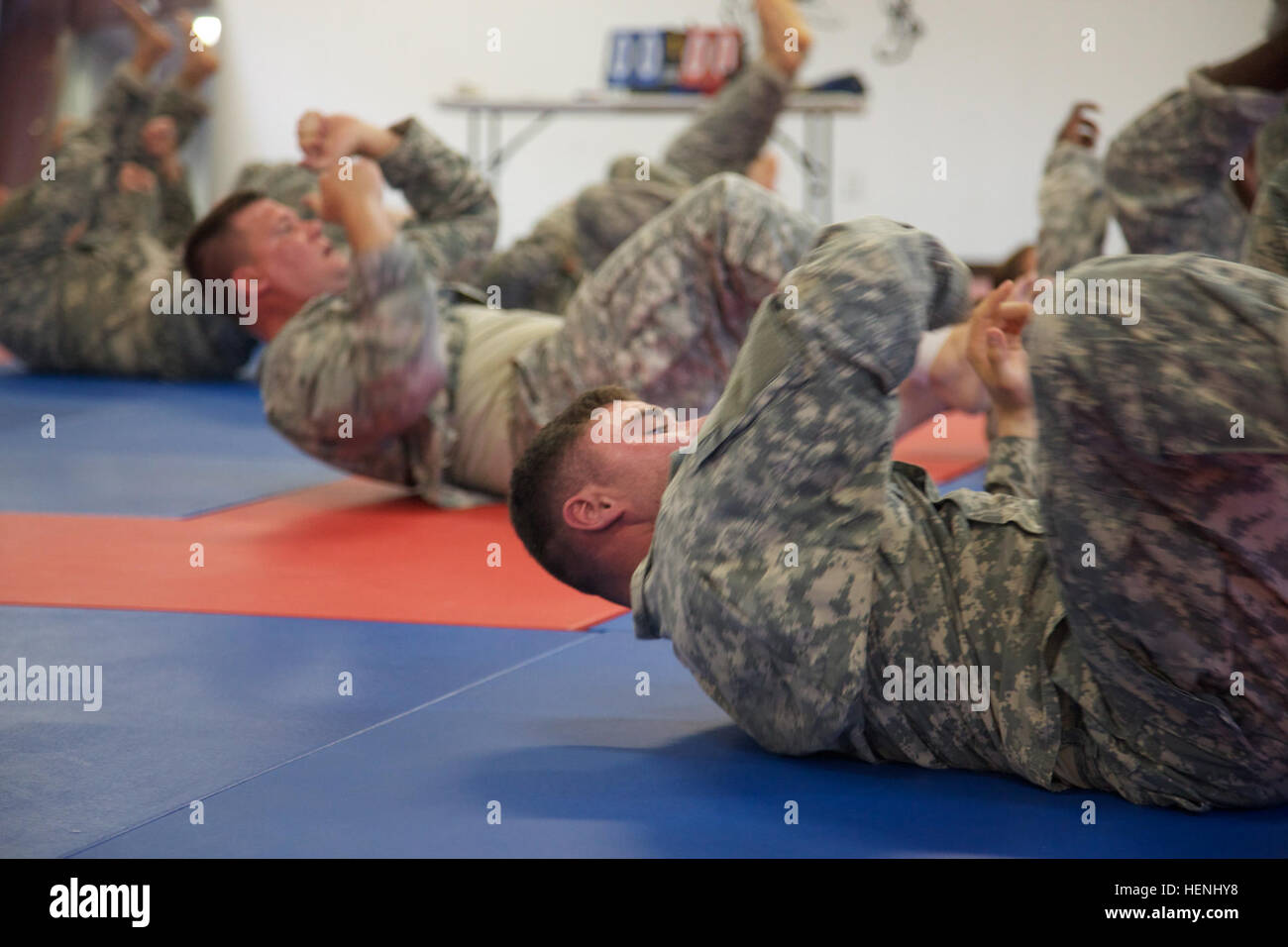 A group of U.S. Army Soldiers conducts different exercises to warm up ...