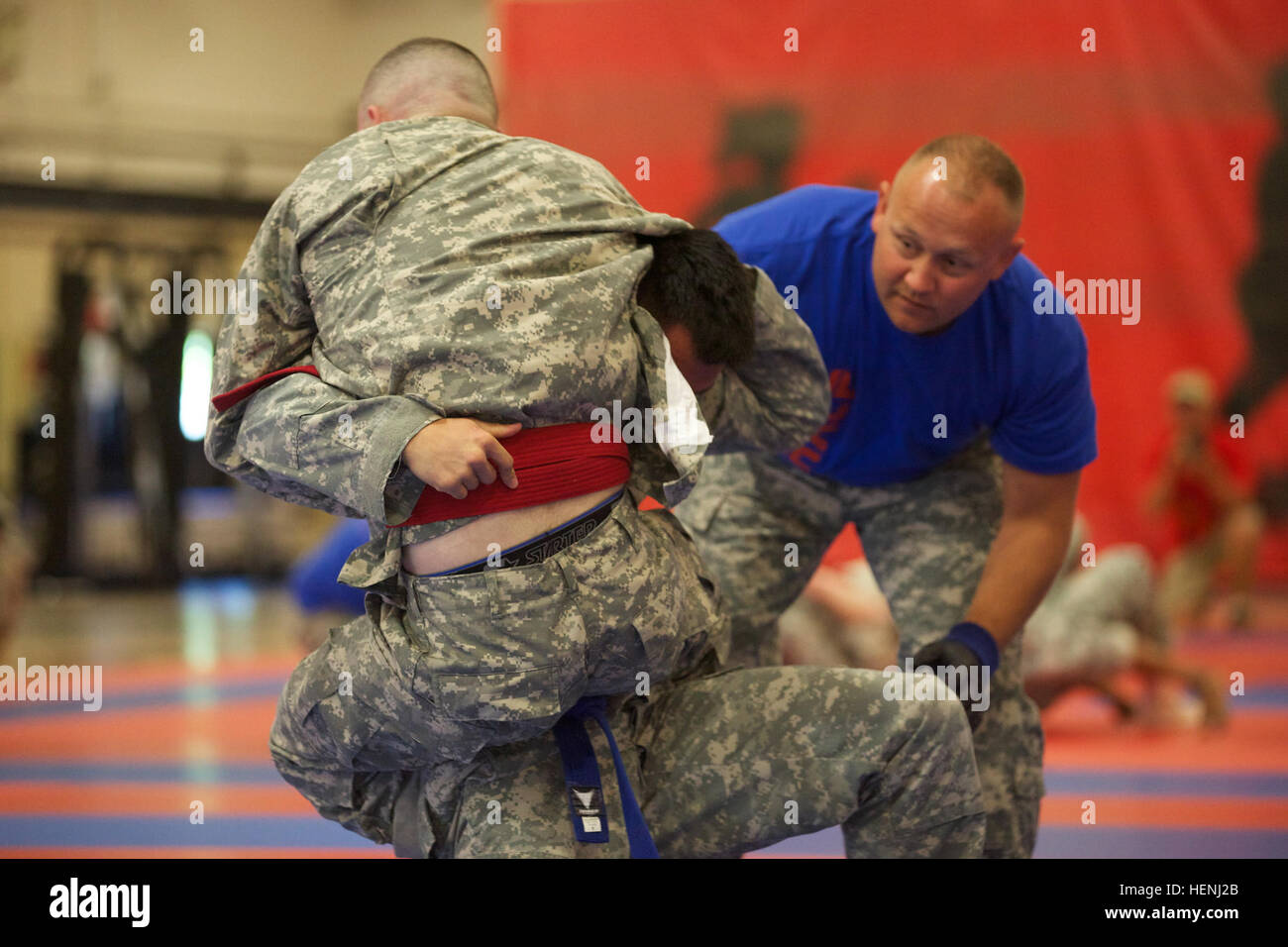 Two U.S. Army Soldiers fight one another while being observed by a ...