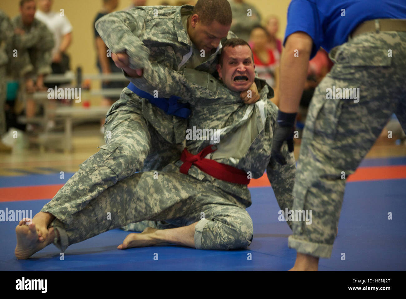 Two U.S. Army Soldiers fight one another while being observed by a ...