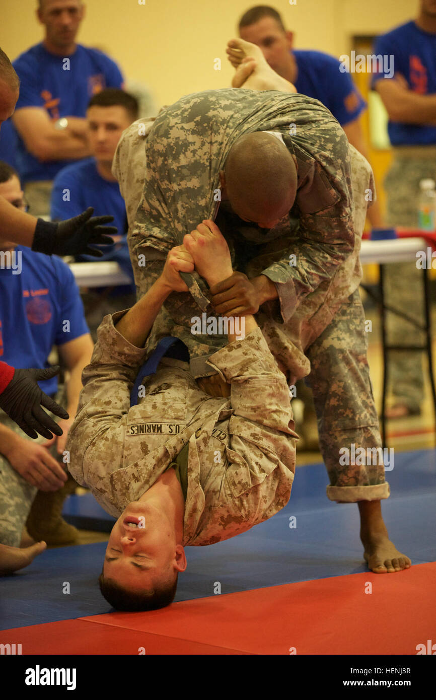 A U.S. Army Soldier and U.S. Marine fight head to head during an Army ...