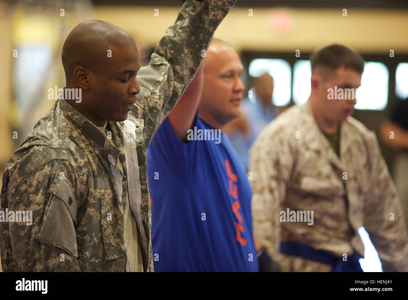 A U.S. Army Combatives Referee declares a winner of a combatives match ...