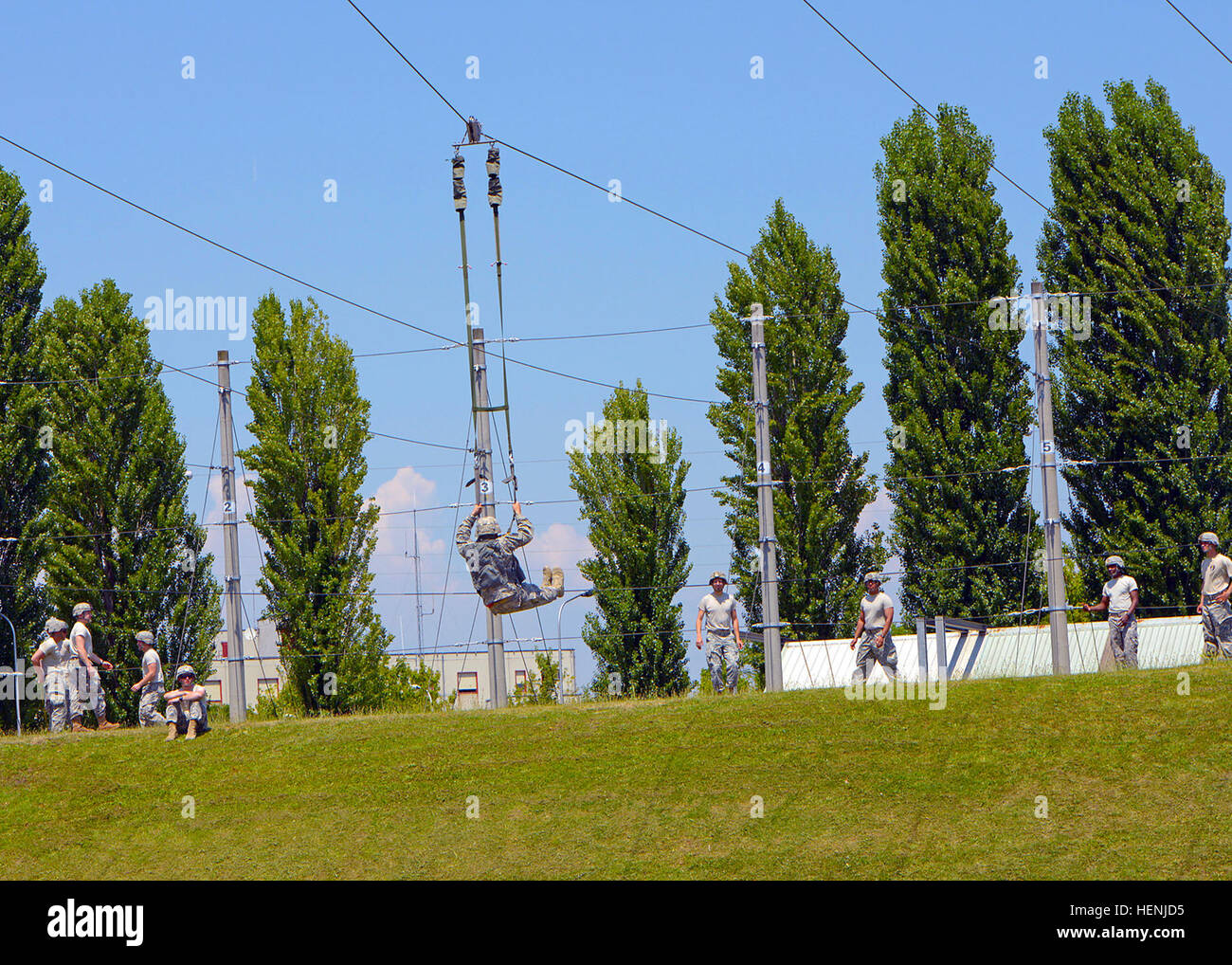 A paratrooper from the 173rd Airborne Brigade lands after jumping from ...