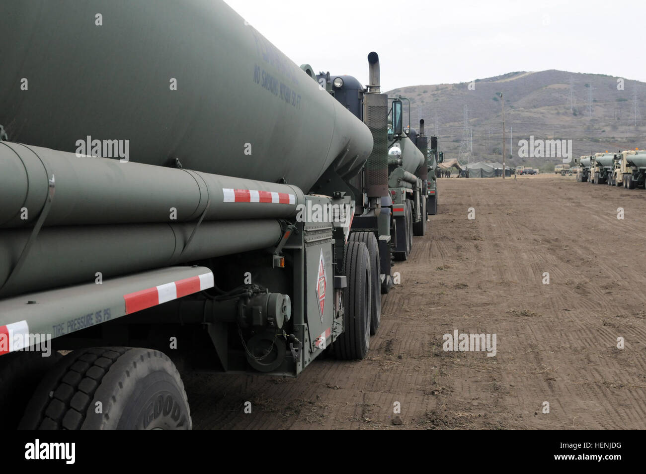 U.S. Army fuel trucks are lined up in the motorpool at the ...