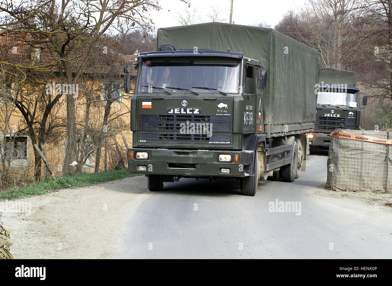 Six trucks from the Polish-Ukrainian Battalion (Polukrbat) transport ...