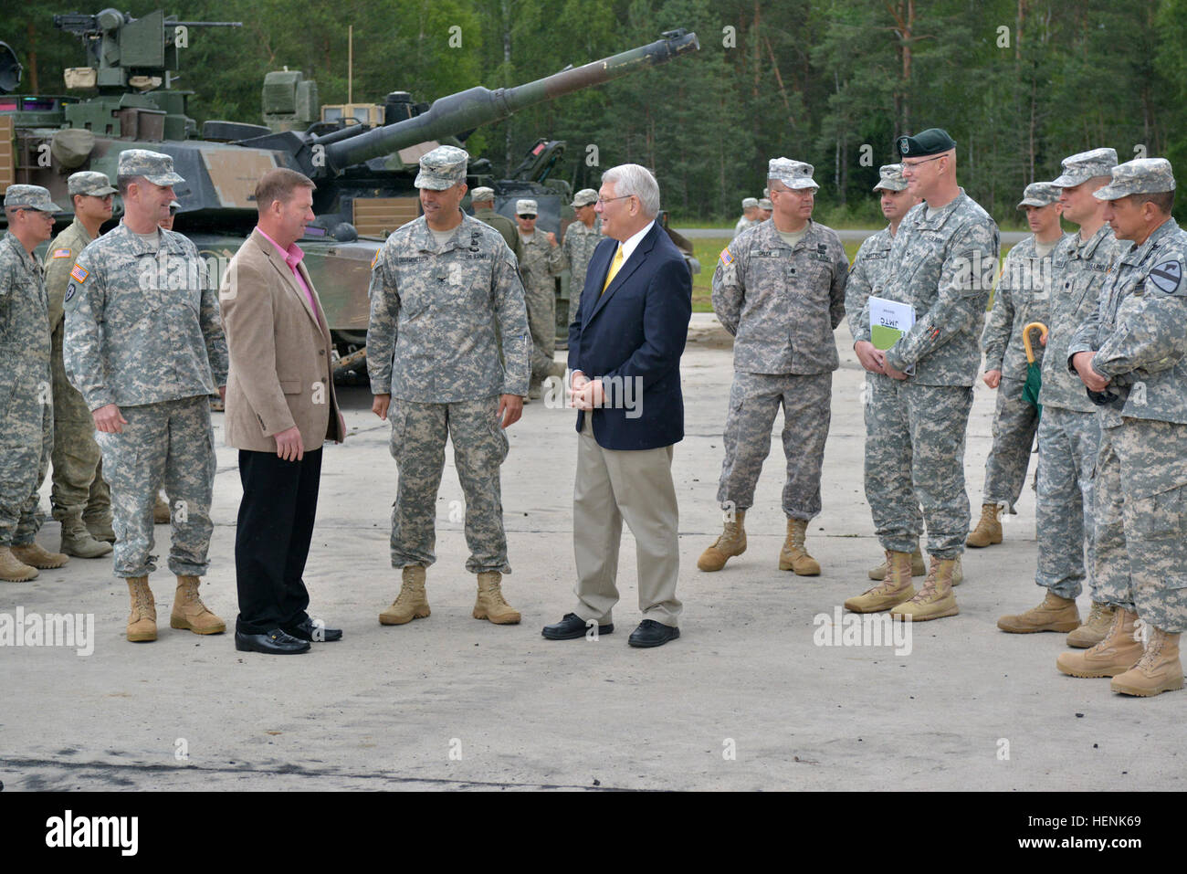 U.S. Army Gen. Carter Ham (ret.) (civilian right) and former Sgt. Maj ...