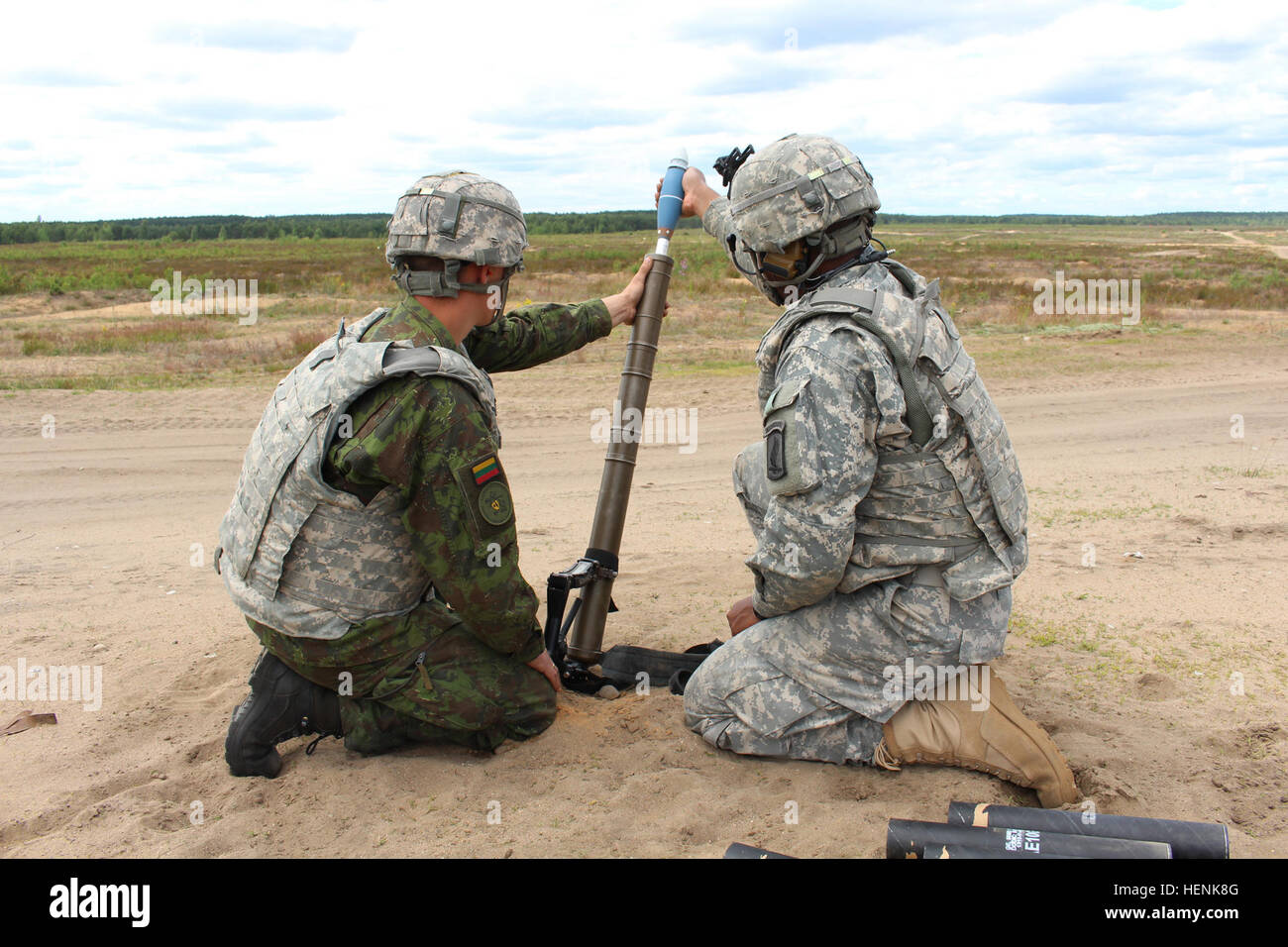 A U.S. mortar gunner from the 173rd Airborne Brigade instructs a ...