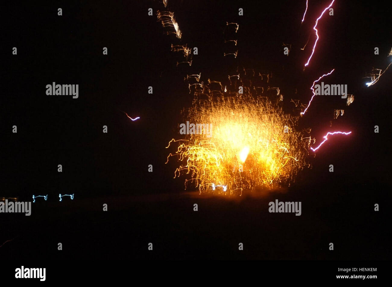 An explosive ordnance disposal team conducts a controlled detonation on ...