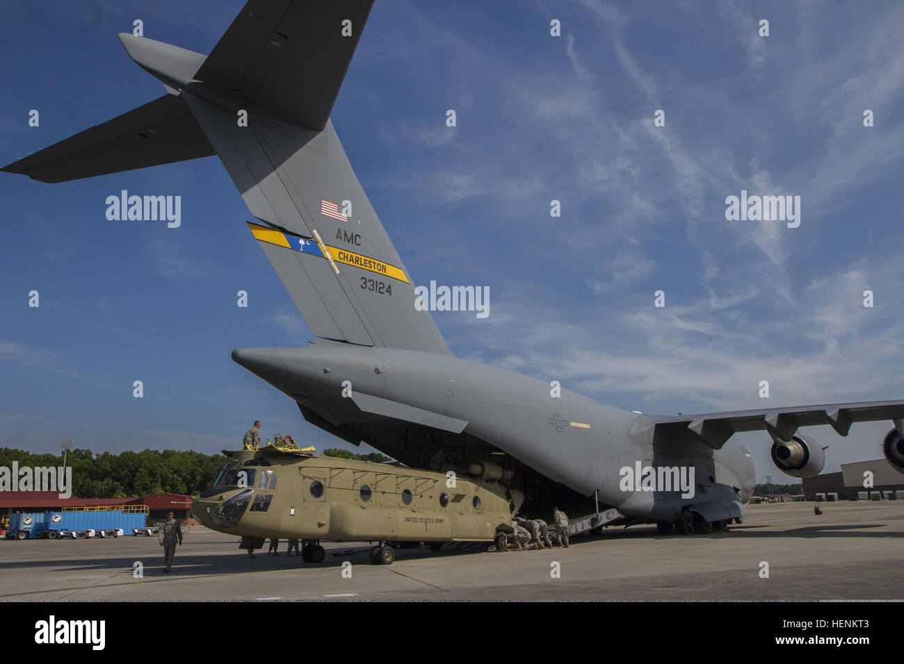 A U.S. Army CH-47F Chinook helicopter is loaded into the cargo area of ...