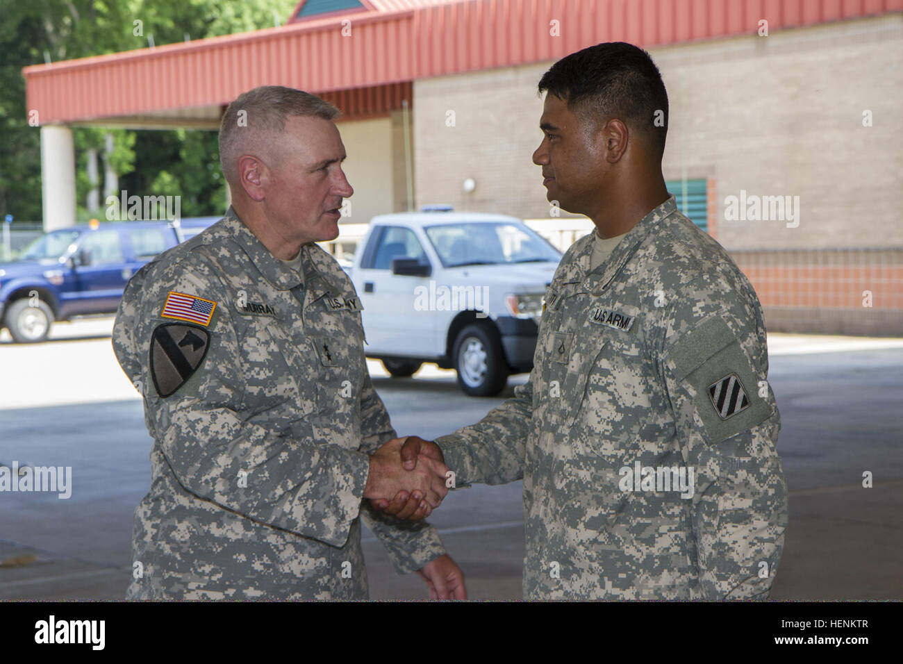 U.S. Army Maj. Gen. Mike Murray, left, the commanding general of the ...