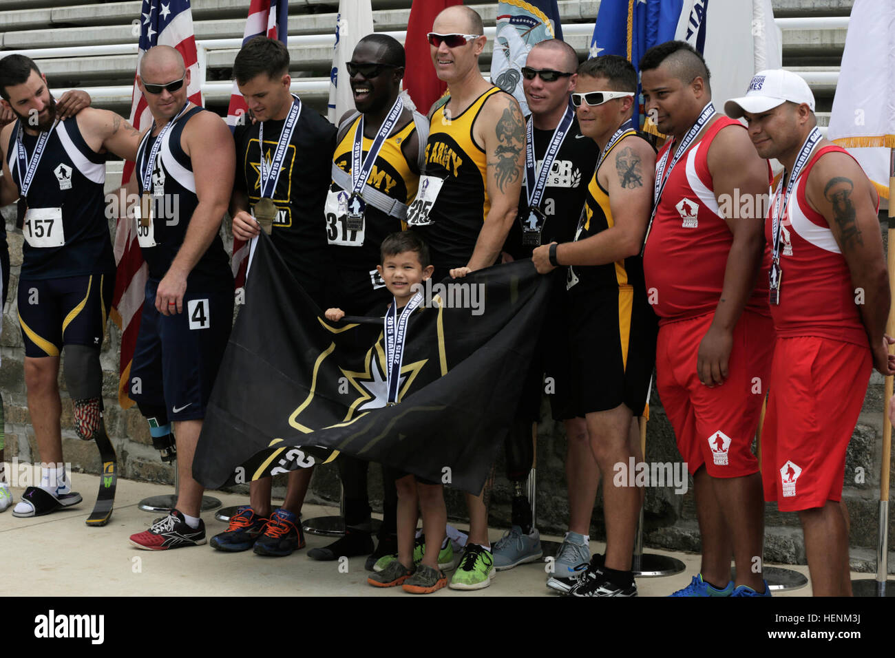 U.S. Army Active Duty and Veteran athletes receive the gold medal for ...