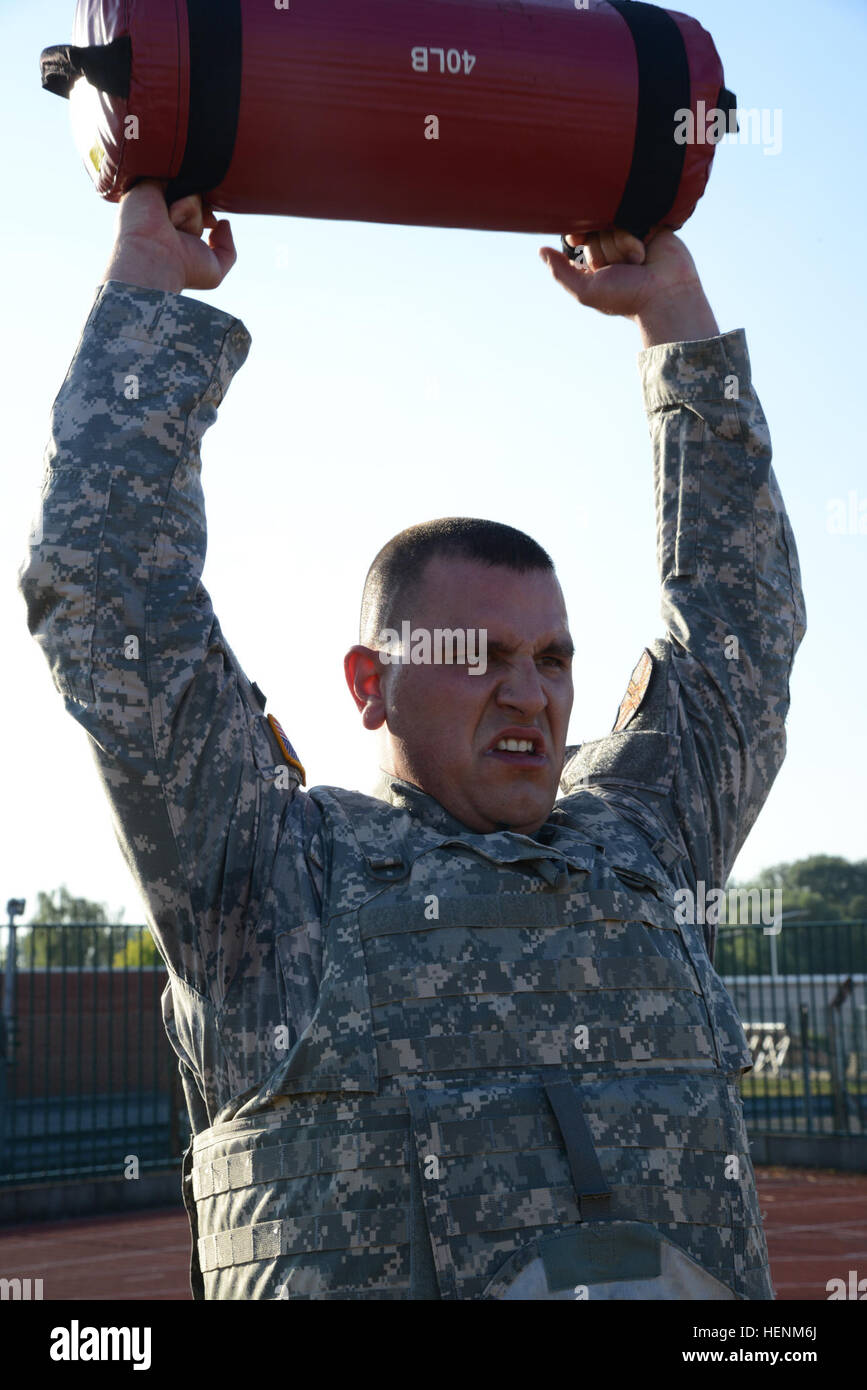 U.S. Army Sgt. Joe Quirarte, with U.S. Army Garrison Benelux, raises ...