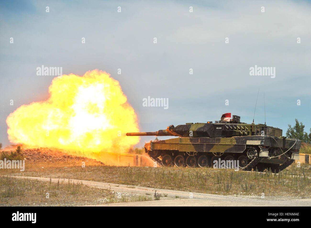 A Royal Danish Army Leopard 2 tank fires at a target during a live-fire ...
