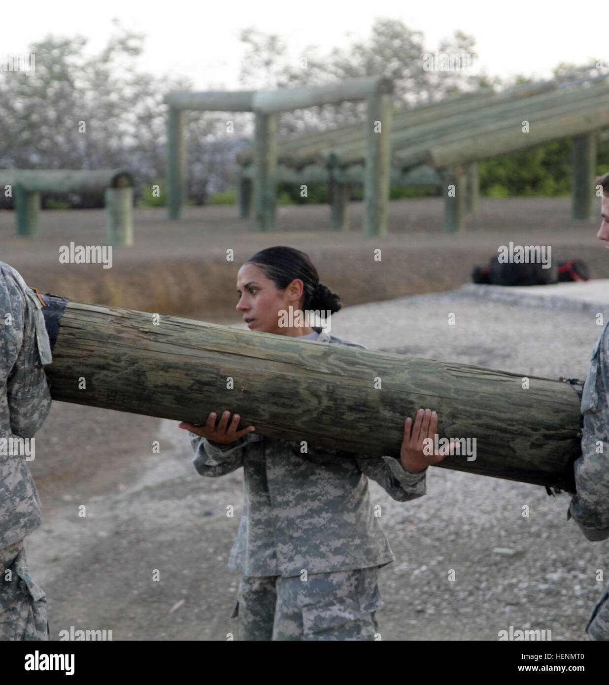 Army Spc. Patricia Williams, assists in the team log carry event during ...