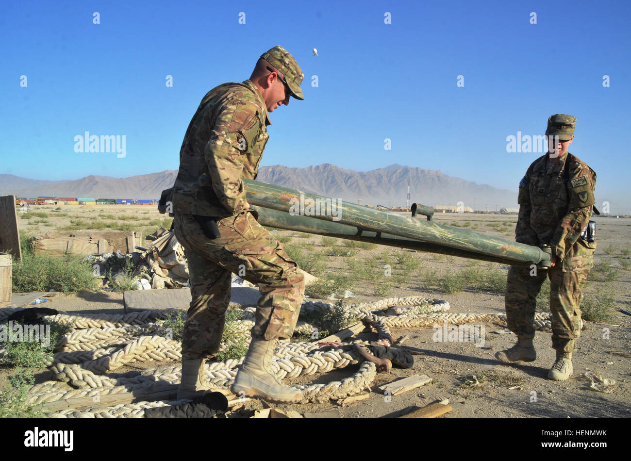 Army logistics officers transport a military tow bar to the 401st Army ...