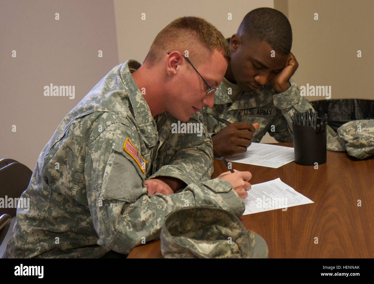 Spc. Thomas Perry (left) and Spc. D'Andres Pace fill out medical ...