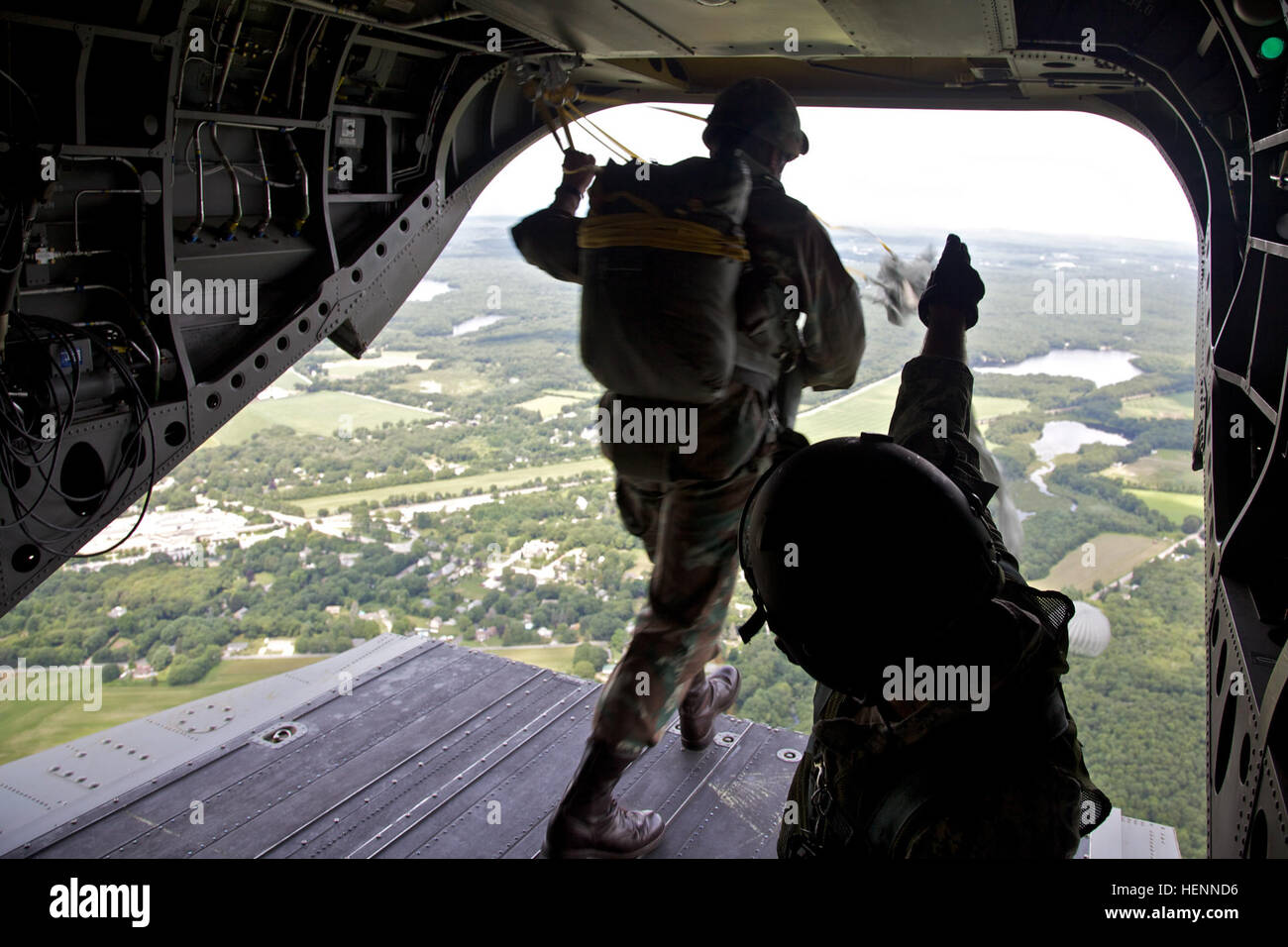 A South African paratrooper jumps off the tailgate of a CH-47 Chinook ...