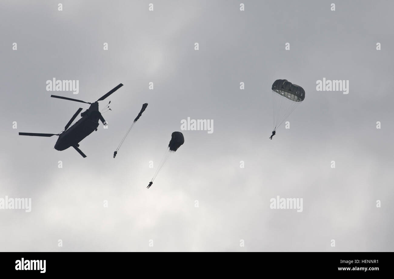 A group of German paratroopers jumps from a CH-47 Chinook Helicopter ...