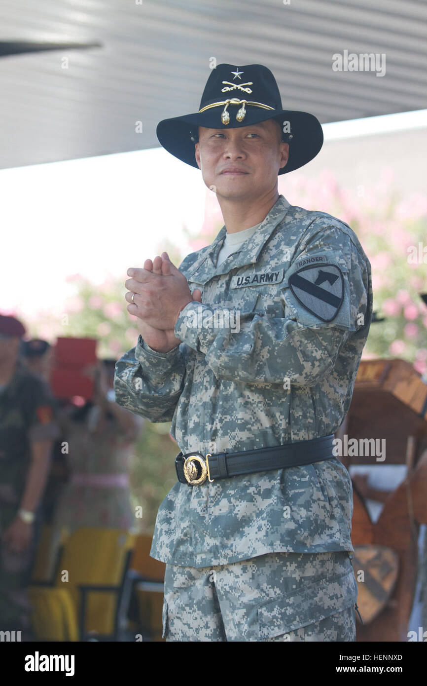Brig. Gen. Viet Luong, deputy commanding general for maneuver, claps to ...