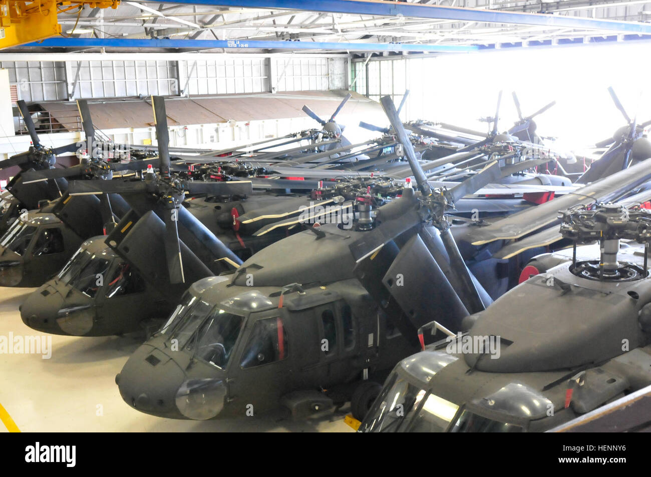 UH-60M Black Hawks are folded and stored in a hangar on Wheeler Army ...