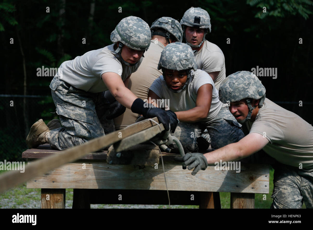 U.S. Soldiers, assigned to the 55th Signal Company (Combat Camera), tie ...