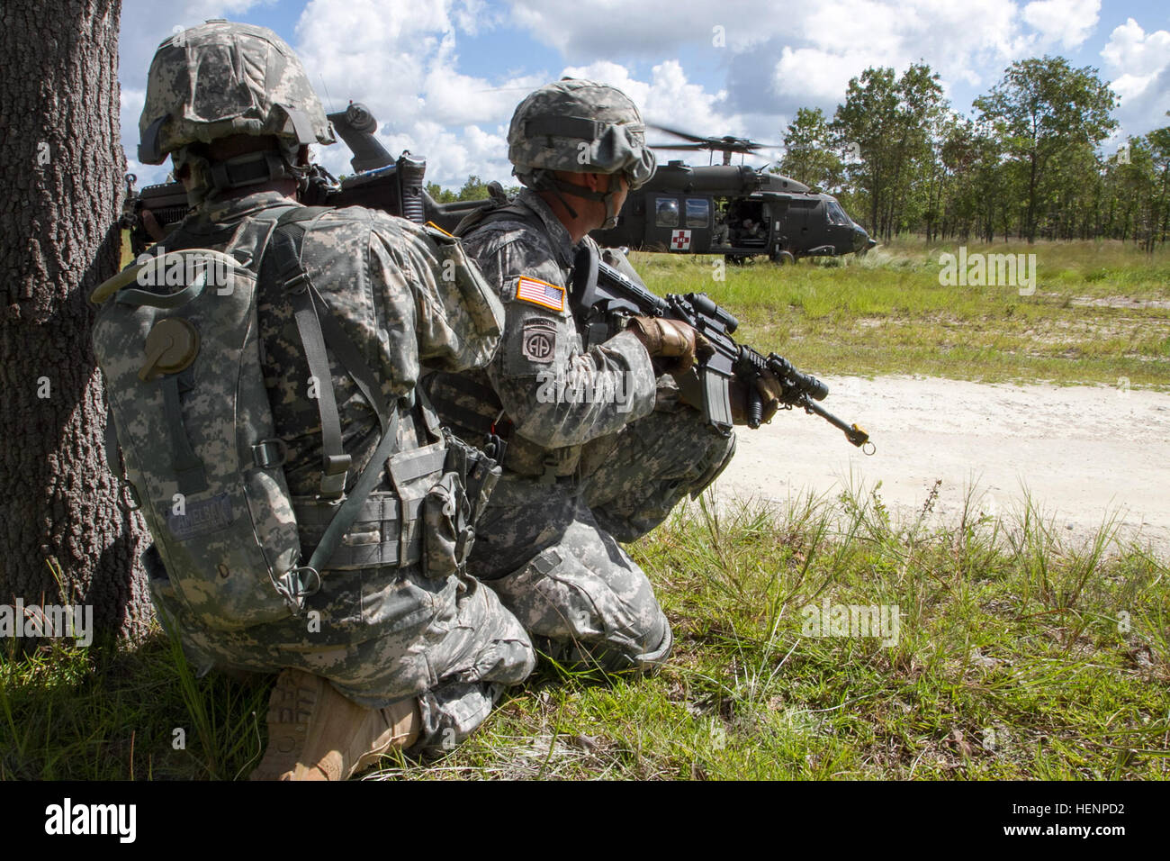 Army Reserve Spc. Michael Edwards, right, provides security while ...