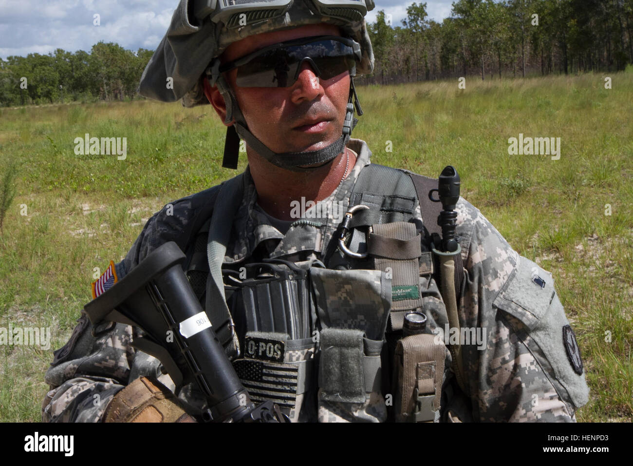 Army Reserve Spc. Michael Edwards provides security while Soldiers load ...
