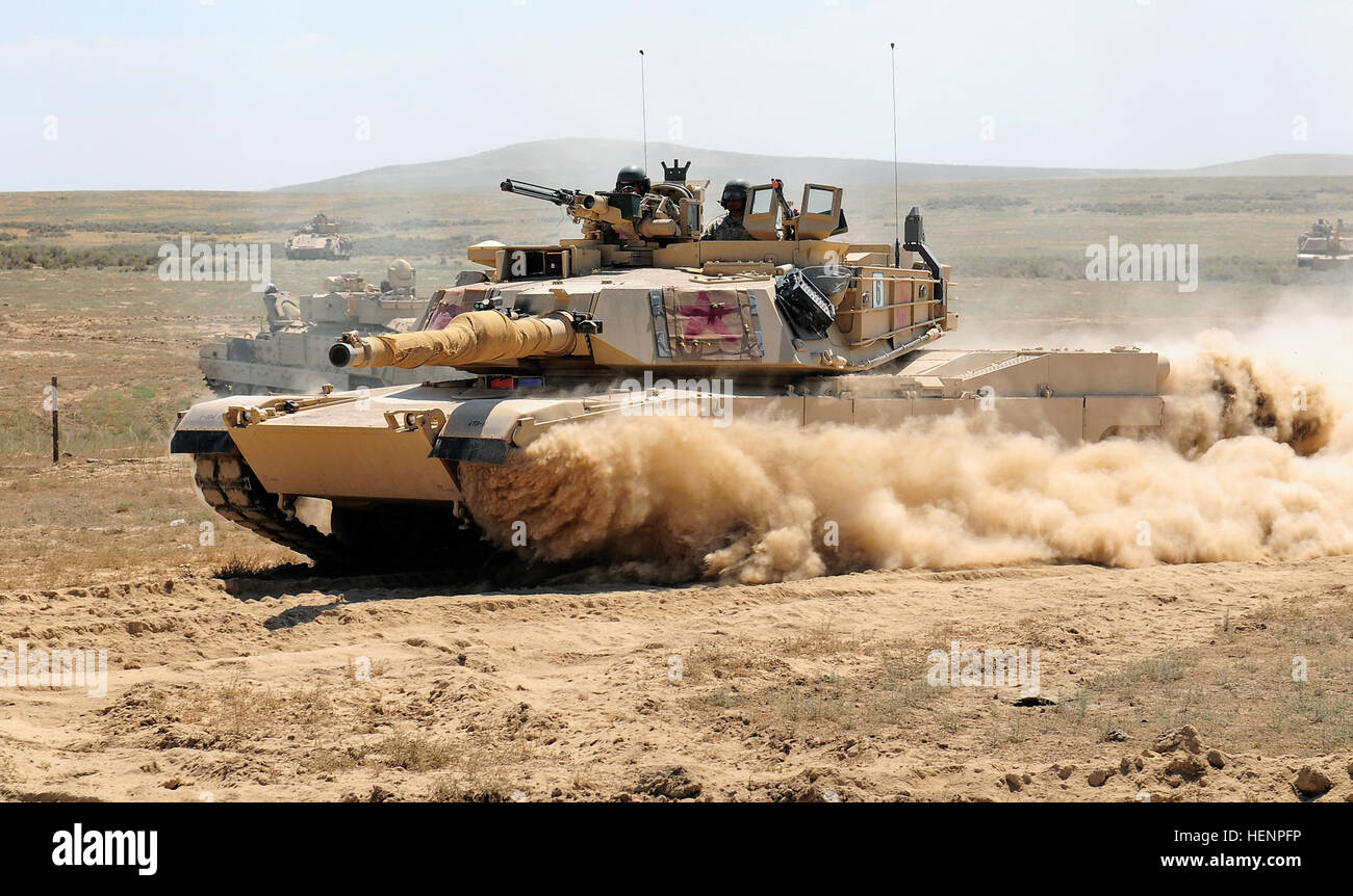 An M1A2 Abrams main battle tank from the Minnesota National Guard races ...