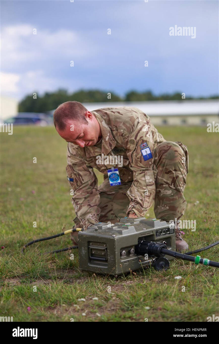 A British Signals Regiment soldier sets up power distribution in ...