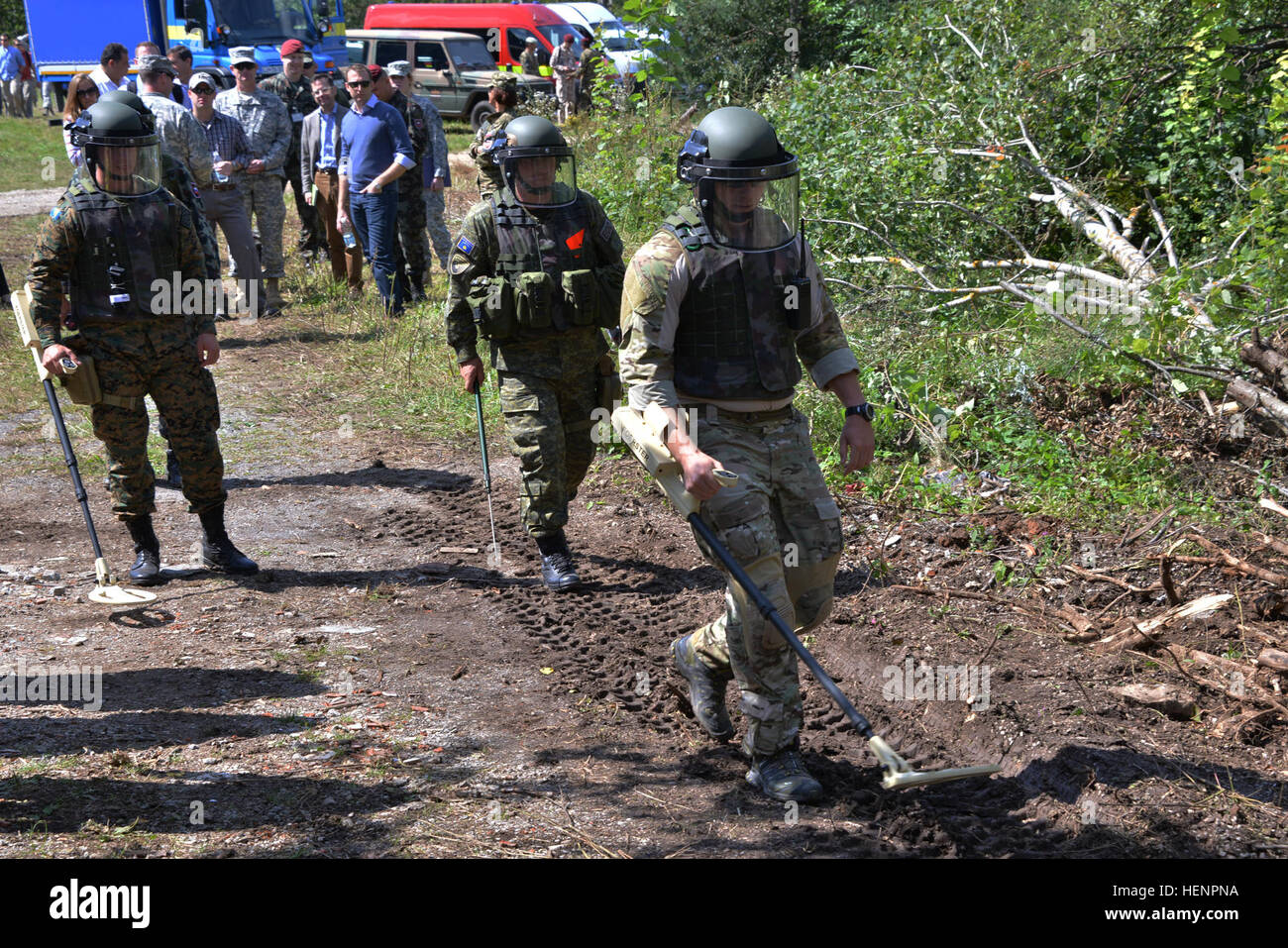 A U.S. Navy explosive ordnance disposal (EOD) technician, foreground ...