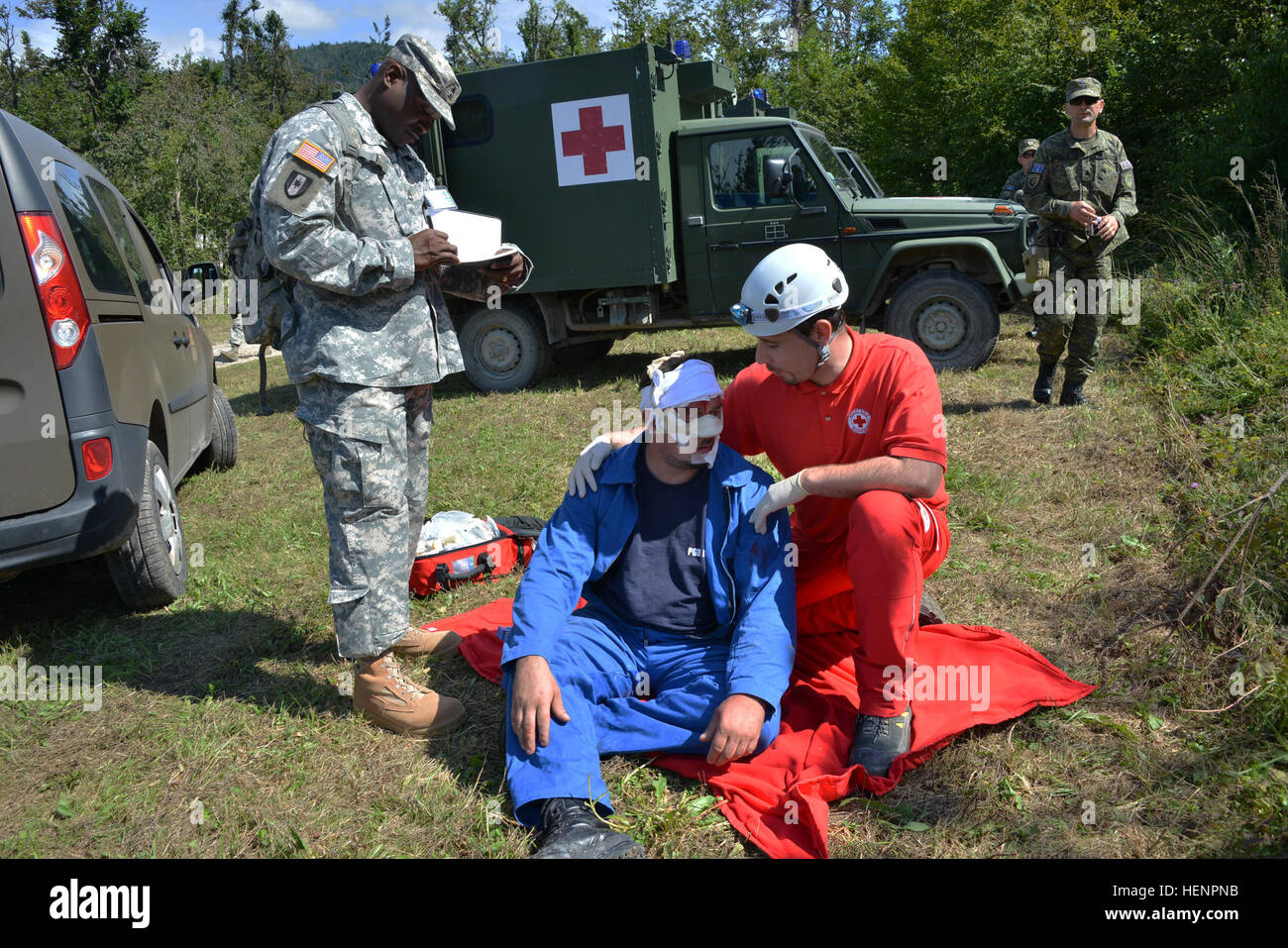 U.S. Army Sgt. 1st Class Ahmad Whitted, standing, an observer ...