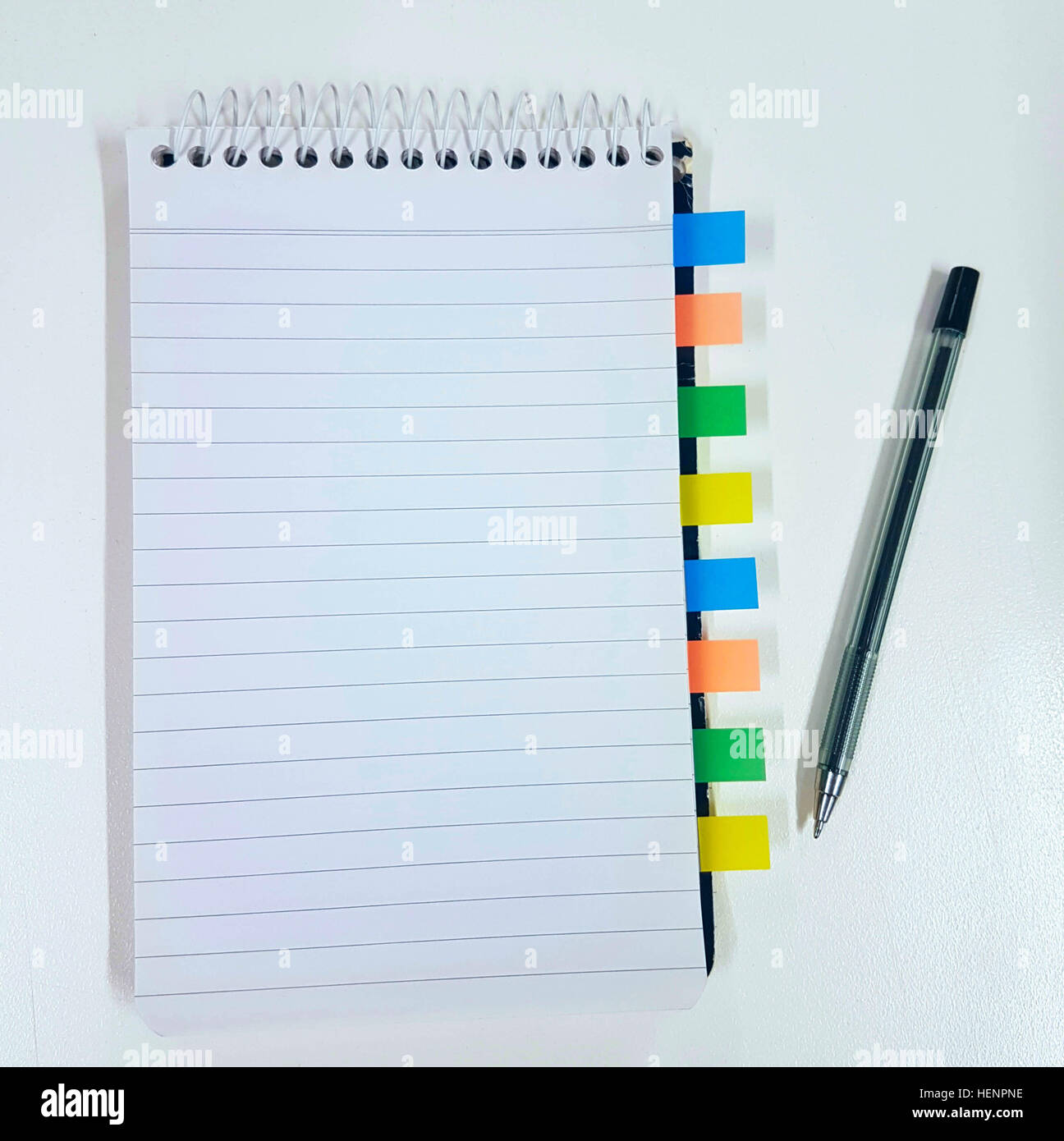 Notepad with colorful flag separation and pen Stock Photo - Alamy