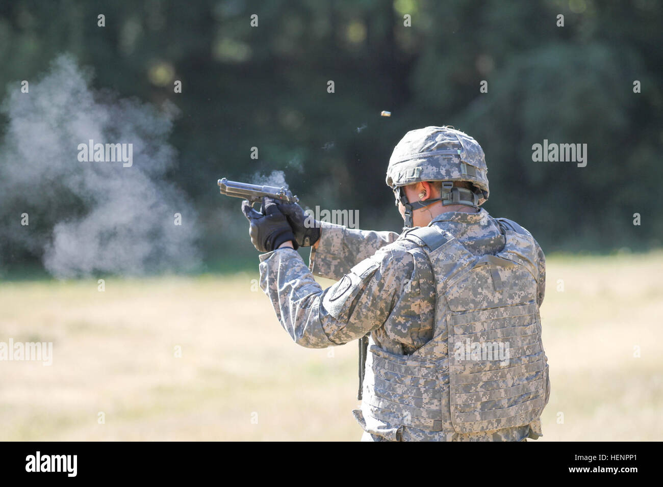 A soldier assigned to 504th Military Police Battalion, shoots an M9 ...