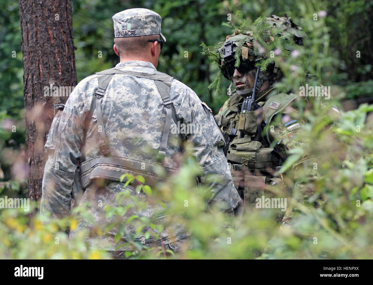 U.S. Army Master Sgt. Robert Longacre, left, an observer-controller ...