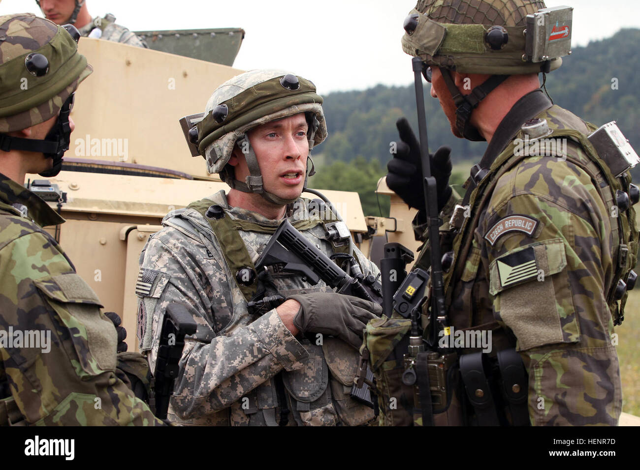 U.S. Army Staff Sgt. Richard Bettis, center, assigned to the 310th ...