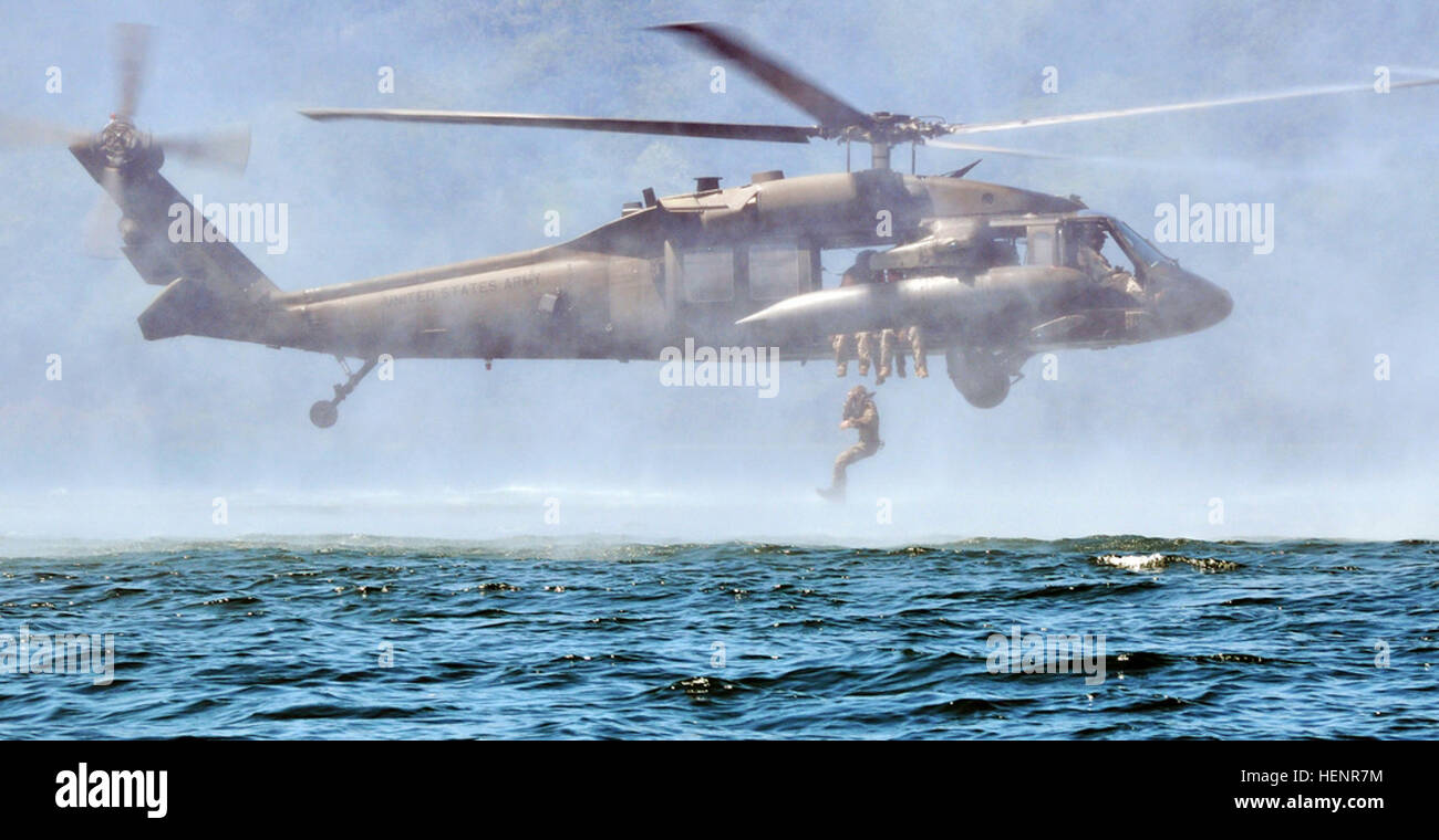 Soldiers conduct helocasting training, deploying from helicopters into ...