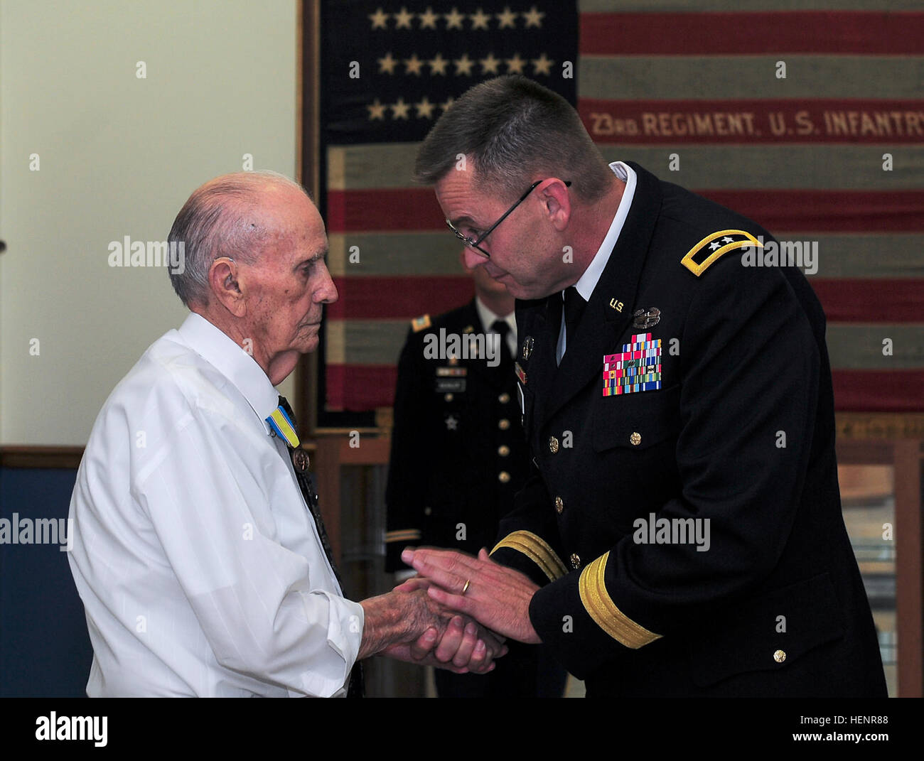 Maj. Gen. Terry Ferrell, 7th Infantry Division commander, shakes hands ...