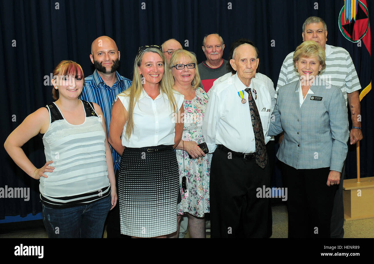 Family, friends, and well-wishers stand next to James Hayden, a retired ...