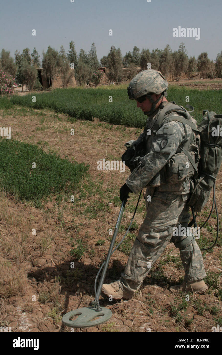 Spc. Joshua Phillips, a native of Sacramento, Calif., uses a metal ...