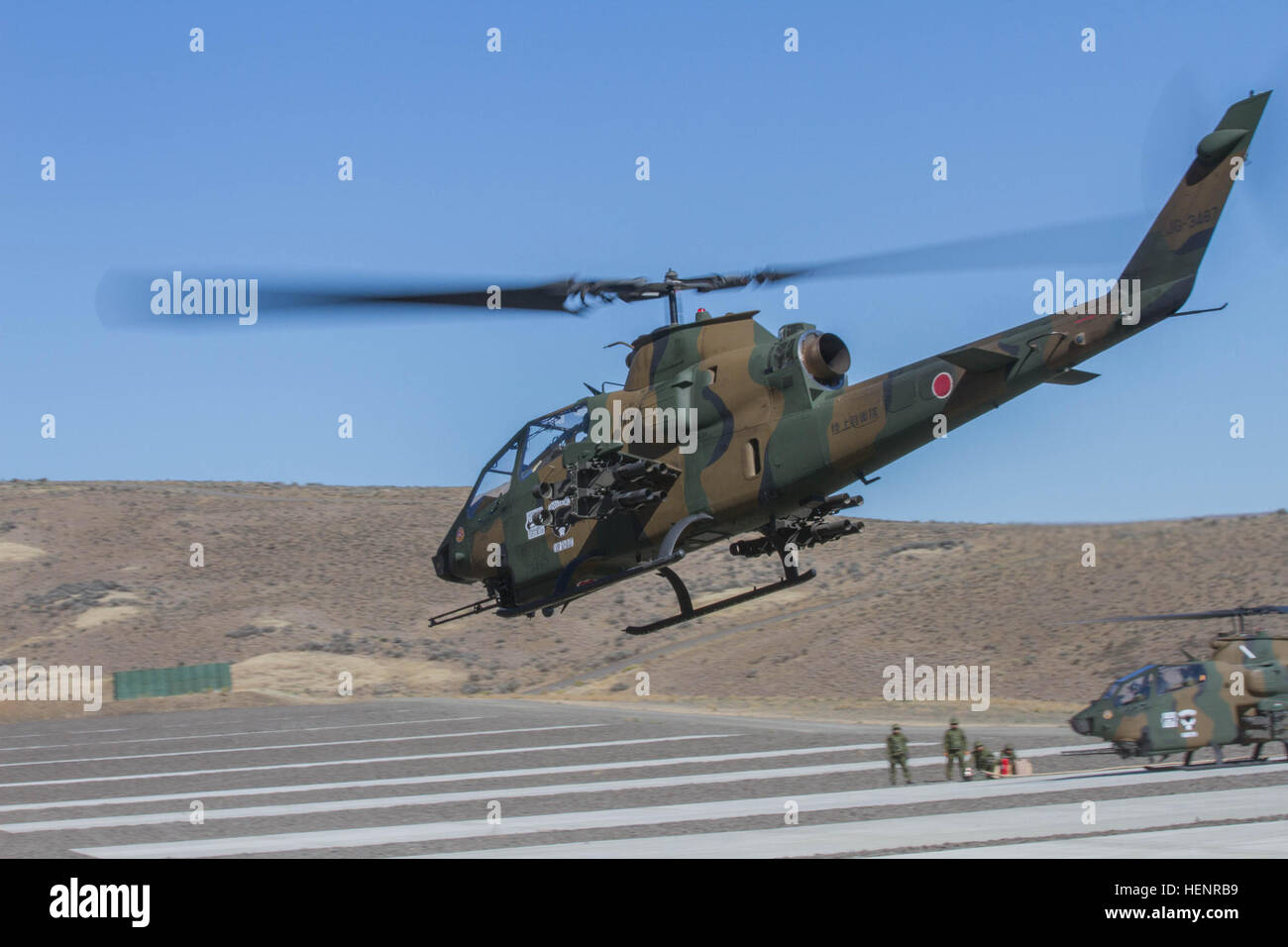 A Japan Ground Self-Defense Force Cobra anti-tank helicopter takes off ...