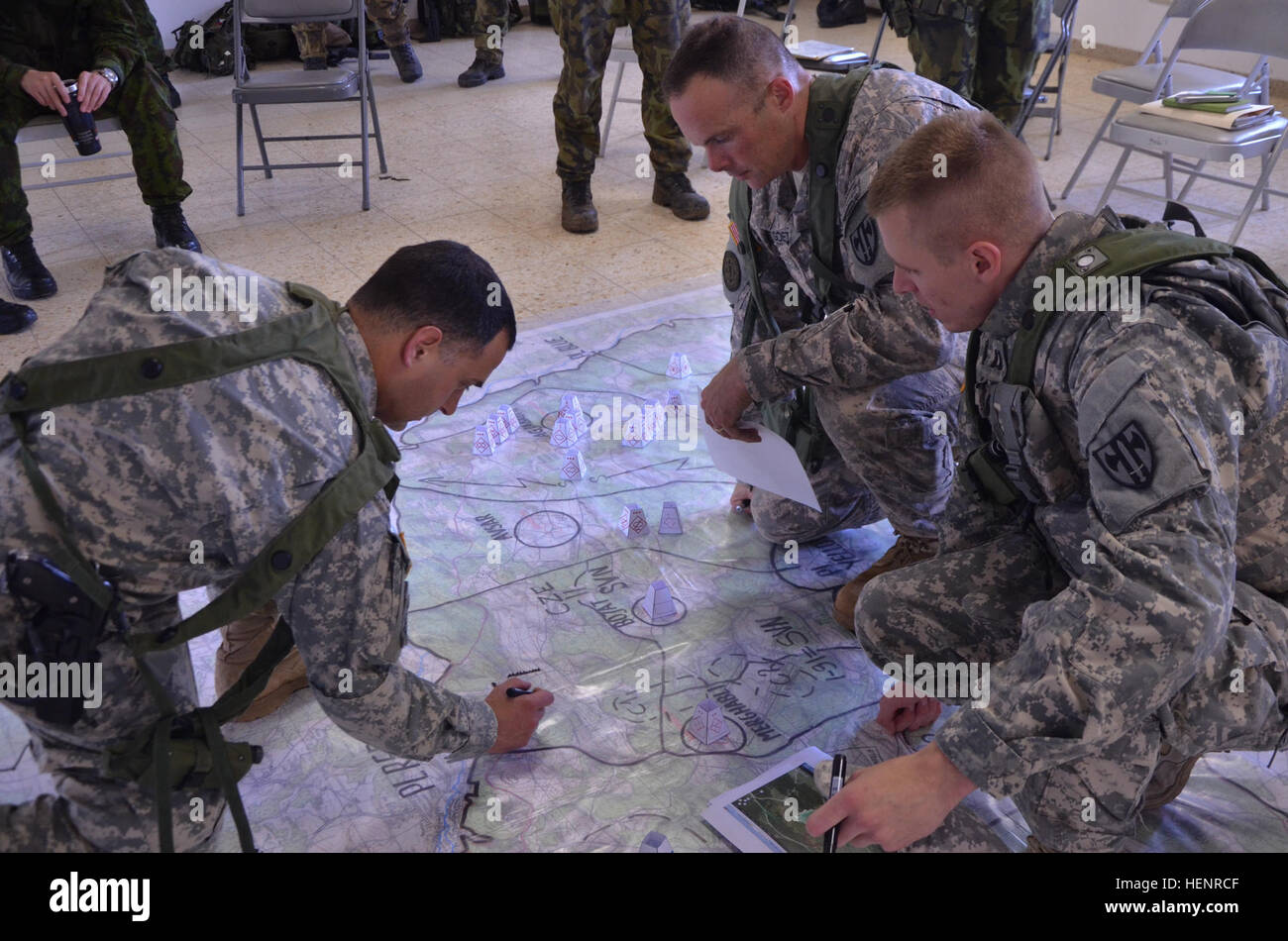 U.S. Soldiers review a combined arms rehearsal map during exercise ...