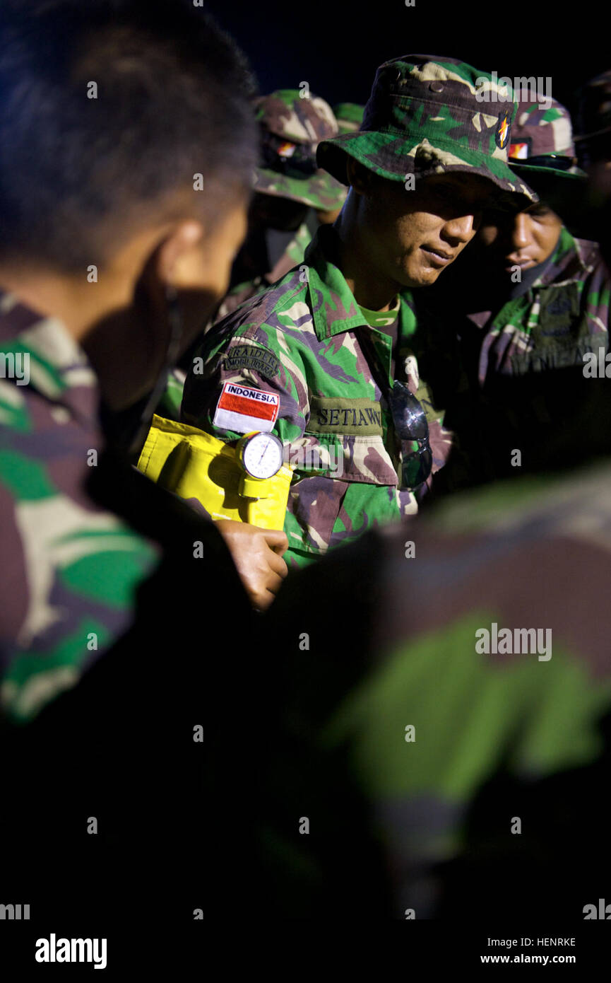 The Indonesian Armed Force's 4-11 Raider Infantry Battalion conducts ...