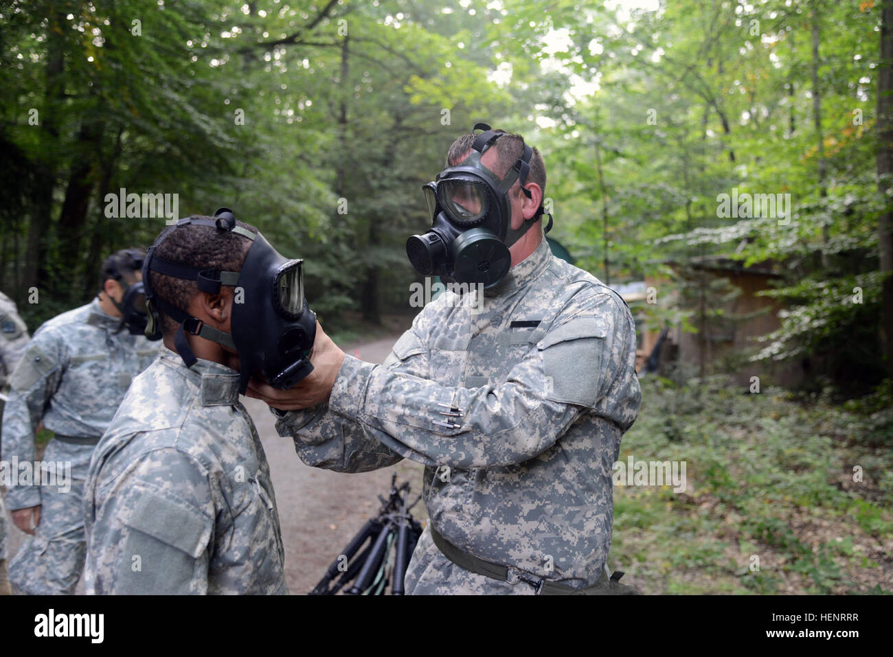 U.S. Army Sgt. 1st Class Dennis Roe, right, assigned to the 52nd Signal ...