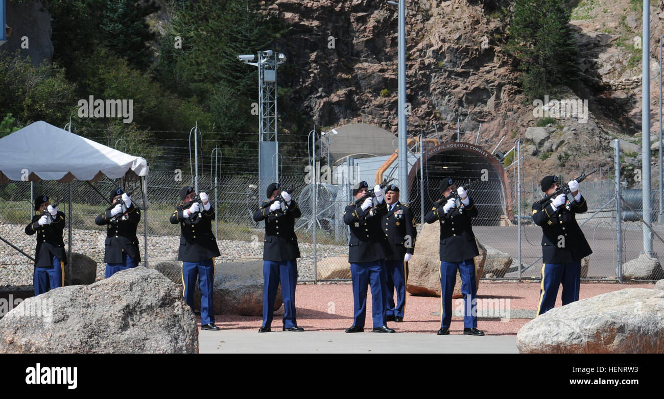 A Joint Task Force Carson rifle team fires a 21-gun salute during a ...