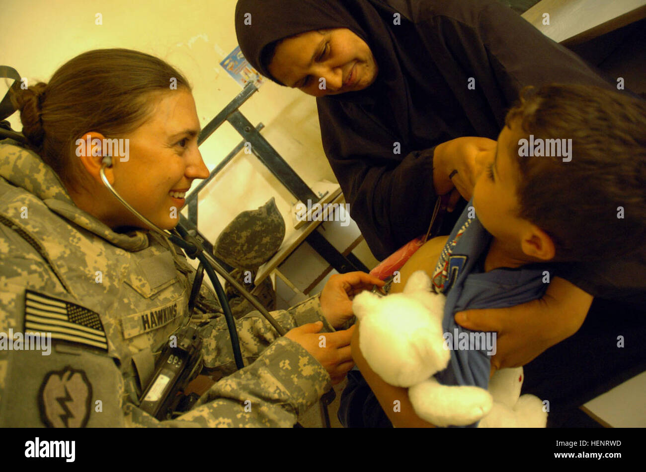 First Lt. Amy Hawkins, a native of Fort Wayne, Ind., checks a boy’s ...