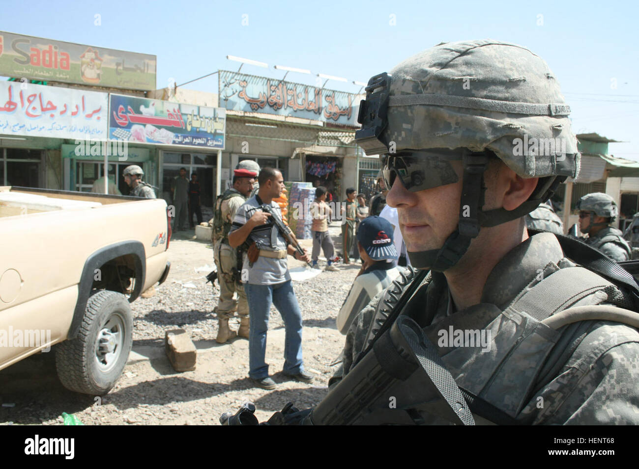 Spc. Gregory Kastner, a Wayzata, Minn., native, patrols a marketplace ...