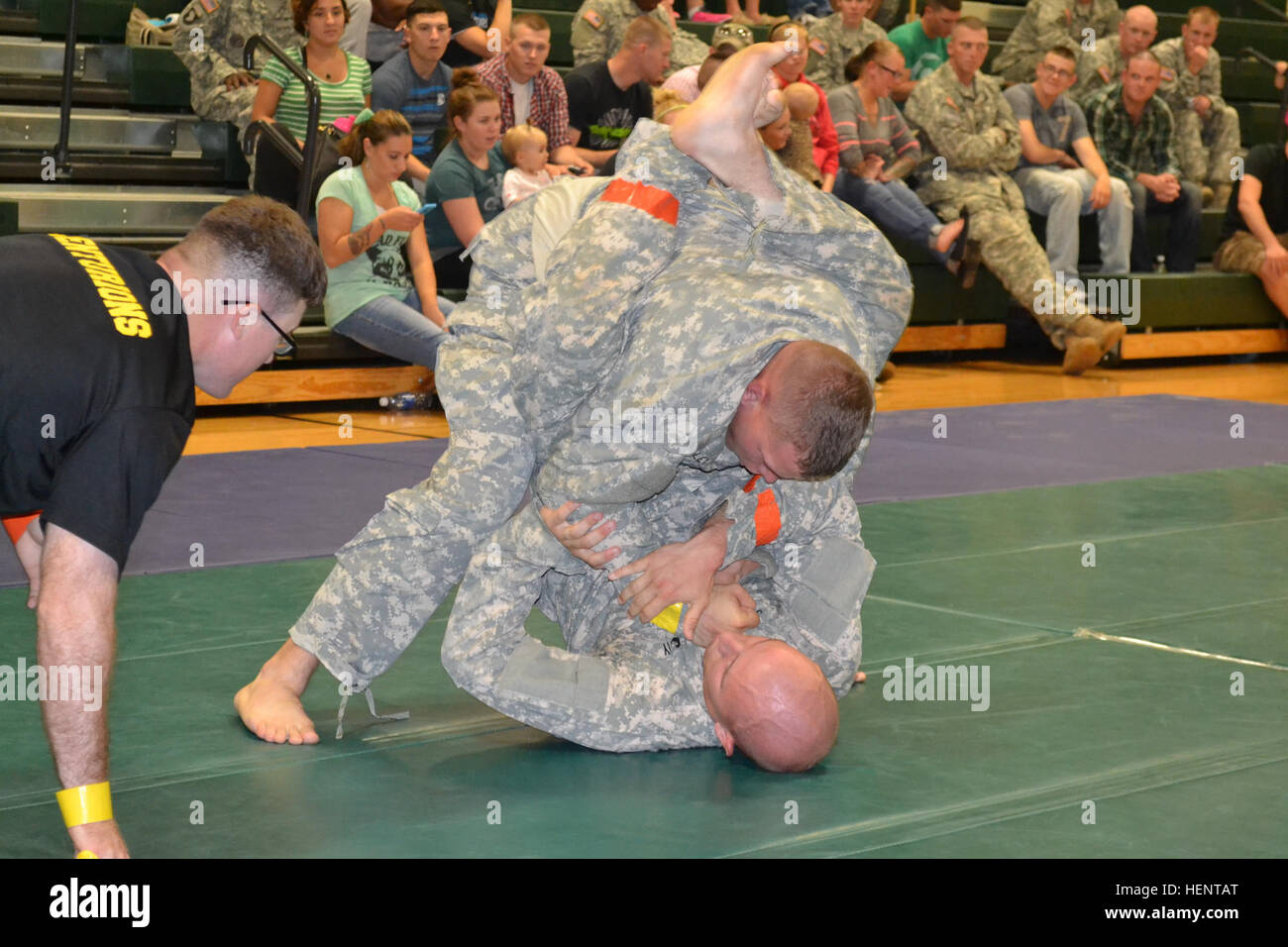 Sgt. David Holley, 252nd Military Police Detachment (top) tries to take ...